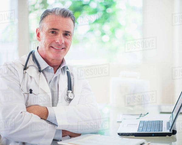 Portrait of doctor in his office - Royalty-free Stock Photo | Dissolve