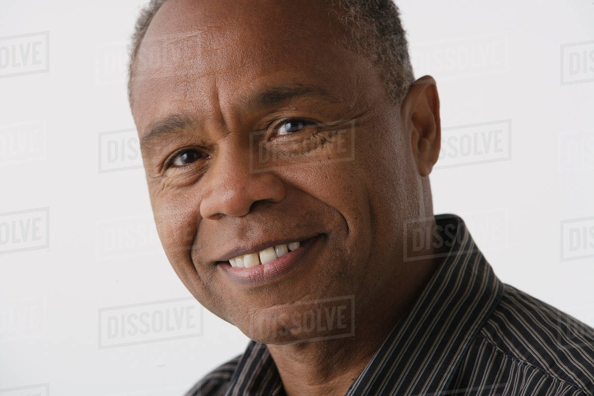Portrait of mature man, studio shot - Stock Photo - Dissolve