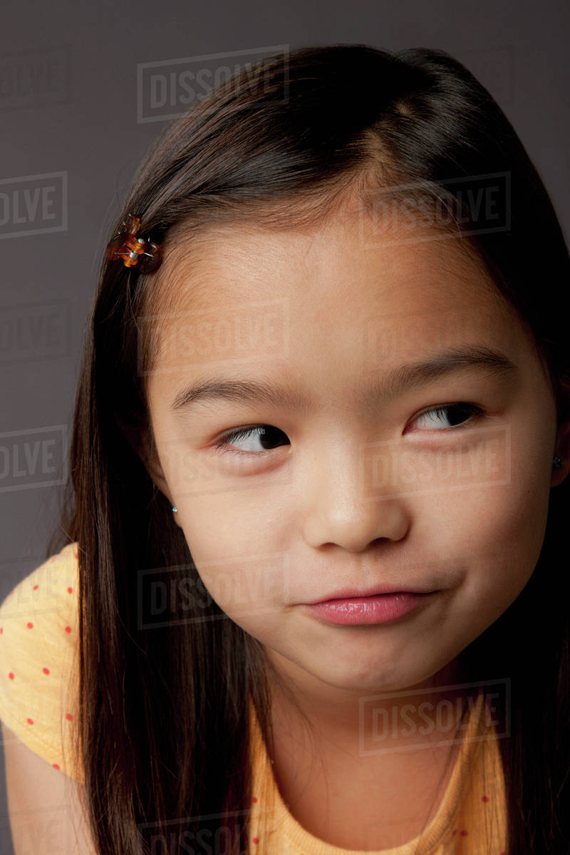 Studio portrait of girl (8-9) - Royalty-free Stock Photo | Dissolve