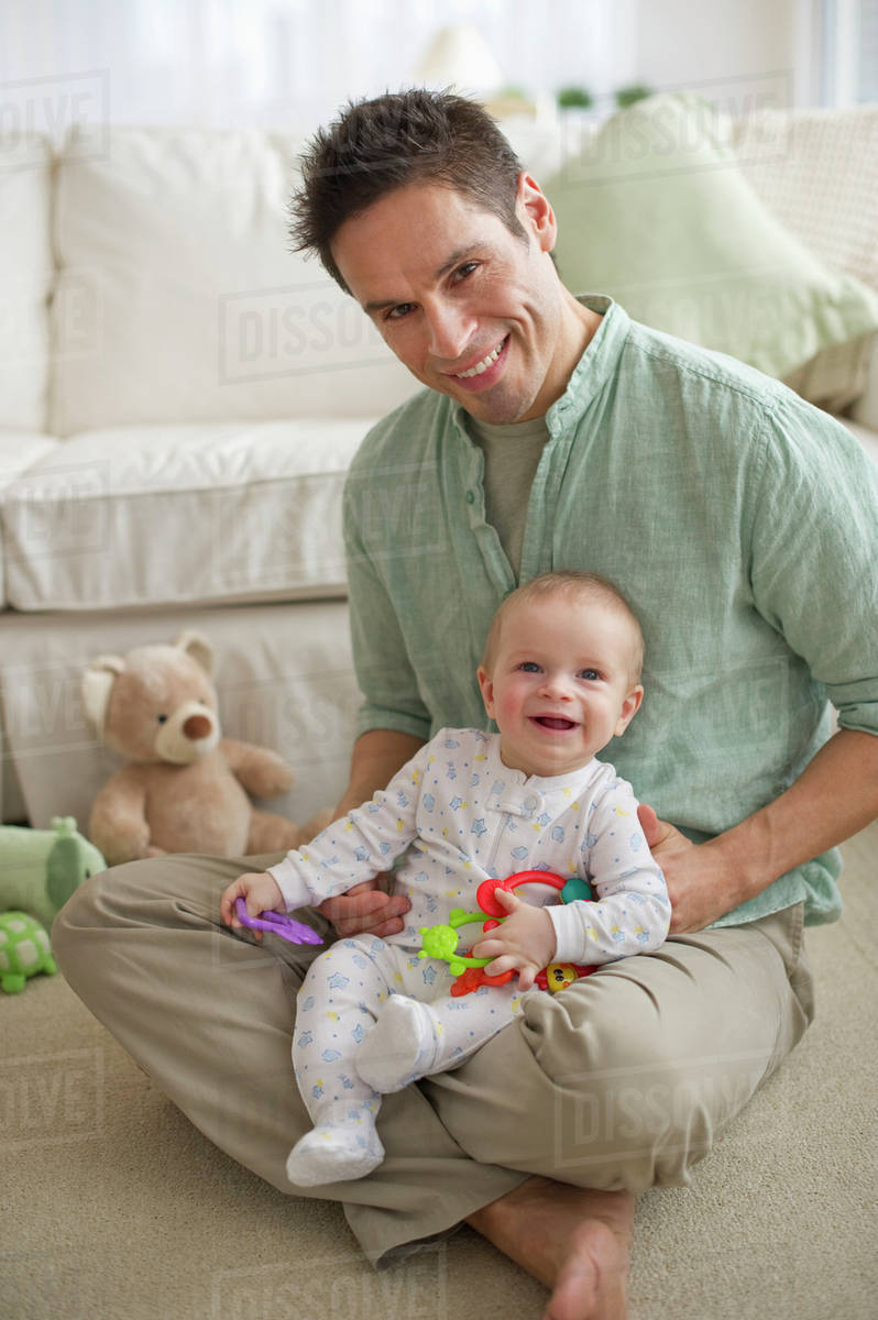 Father sitting with baby - Royalty-free Stock Photo | Dissolve
