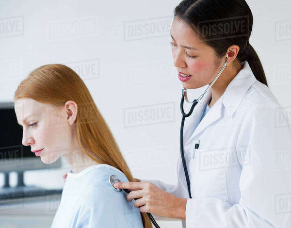 Doctor and patient at checkup - Royalty-free Stock Photo | Dissolve