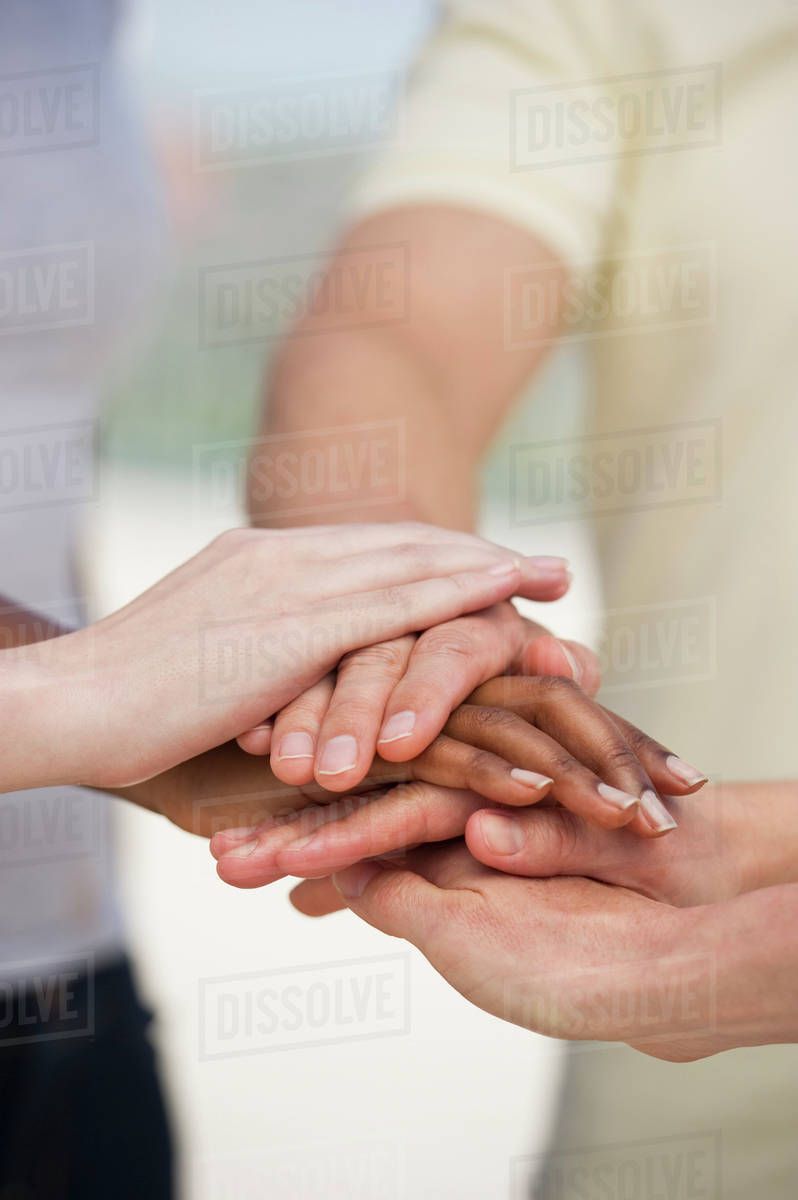 Hands atop one another - Royalty-free Stock Photo | Dissolve