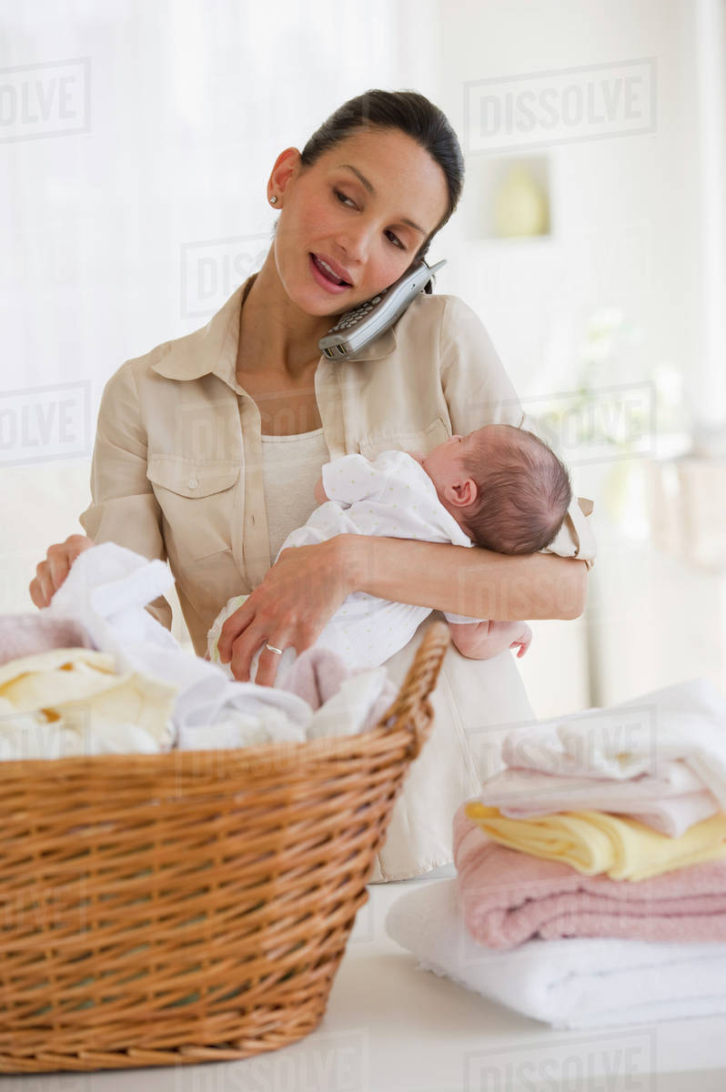 Multi-tasking mother - Royalty-free Stock Photo | Dissolve