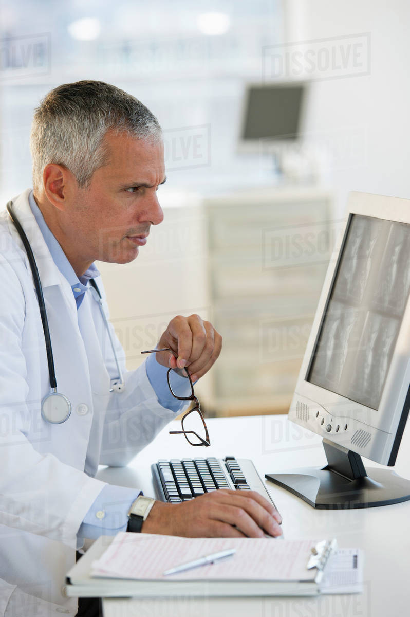 Doctor working on computer - Royalty-free Stock Photo | Dissolve