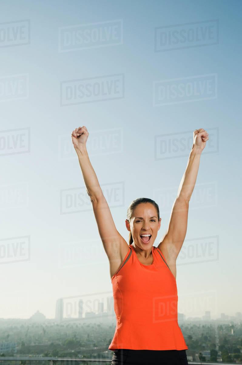 Woman cheering - Royalty-free Stock Photo | Dissolve