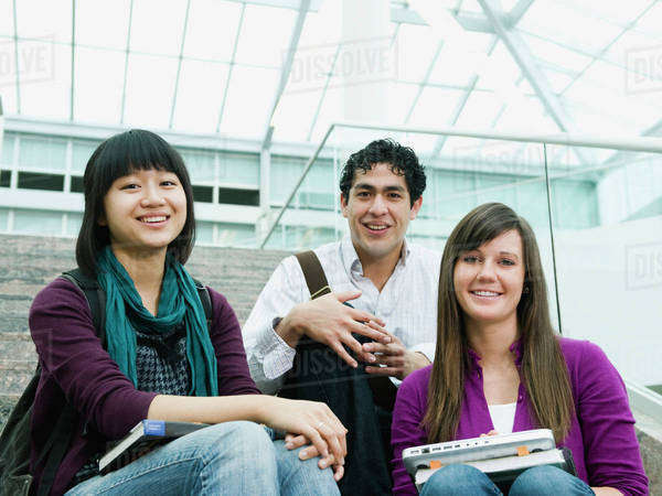 College students sitting on steps in front of library - Royalty-free ...