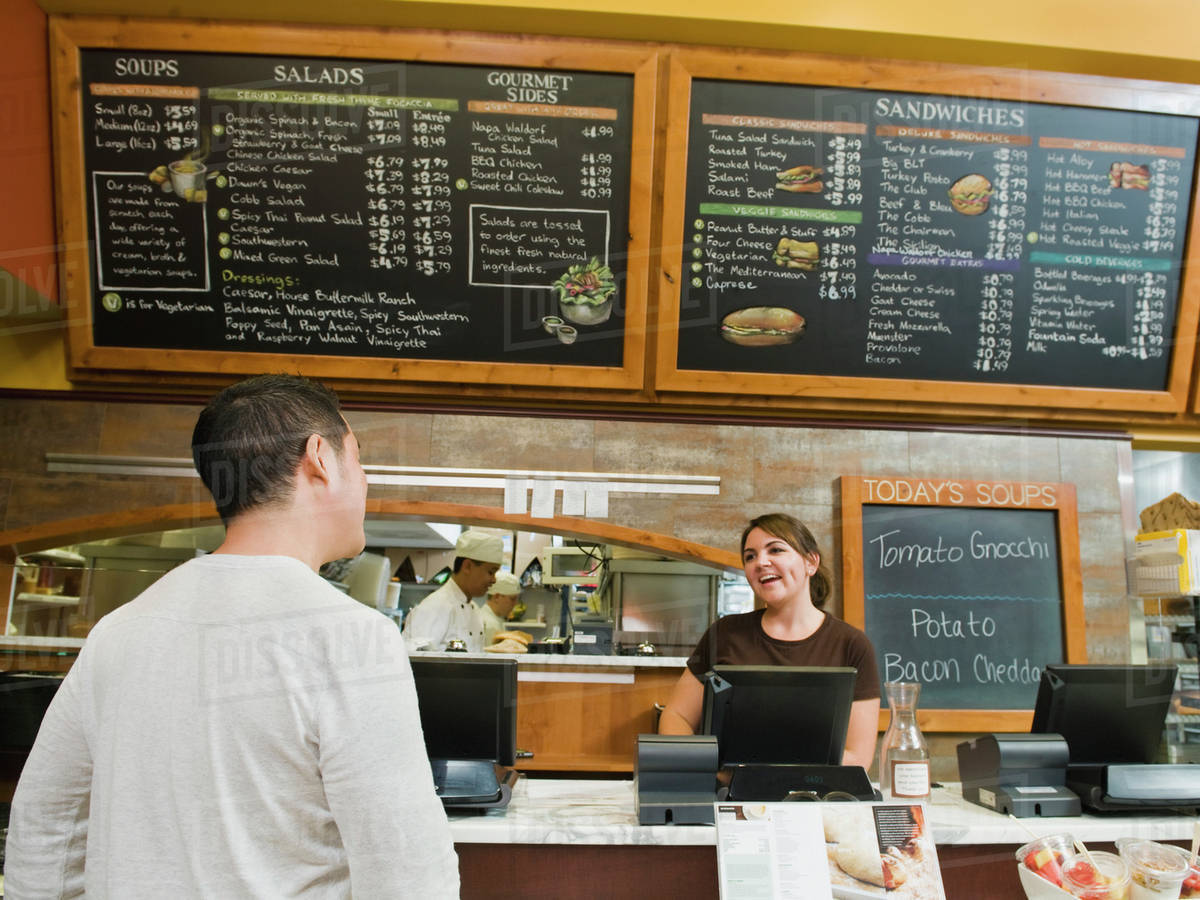 Customer ordering food at bakery - Royalty-free Stock Photo | Dissolve