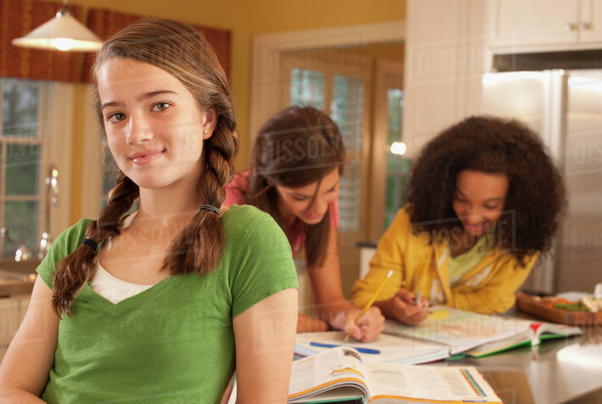 Friends doing homework - Royalty-free Stock Photo | Dissolve