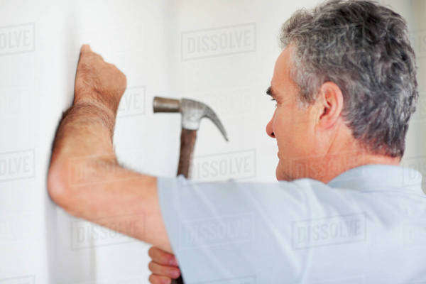 Man using a hammer - Royalty-free Stock Photo | Dissolve