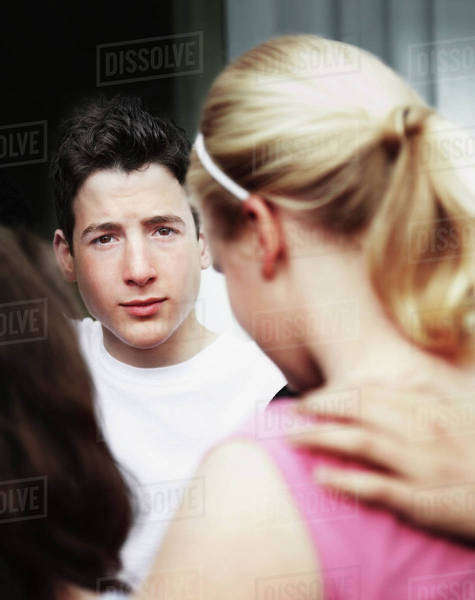 Friends huddled together - Royalty-free Stock Photo | Dissolve