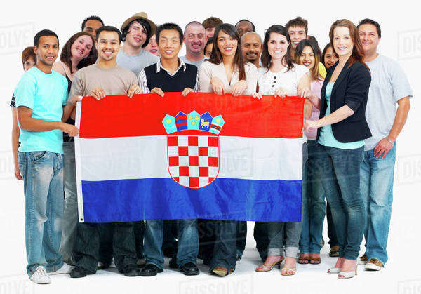 Group of people holding flag - Stock Photo - Dissolve