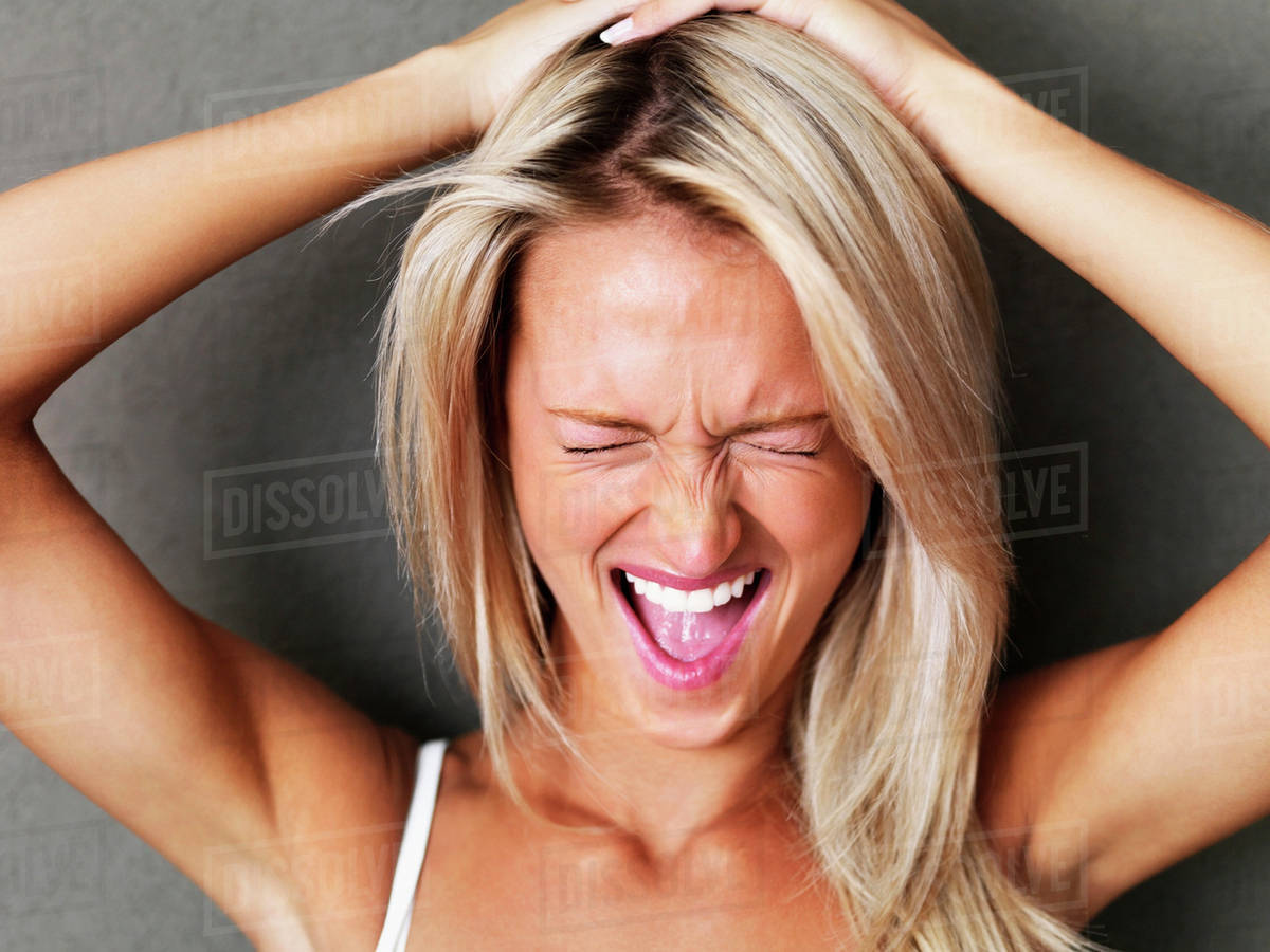 Beautiful blond woman screaming - Royalty-free Stock Photo | Dissolve