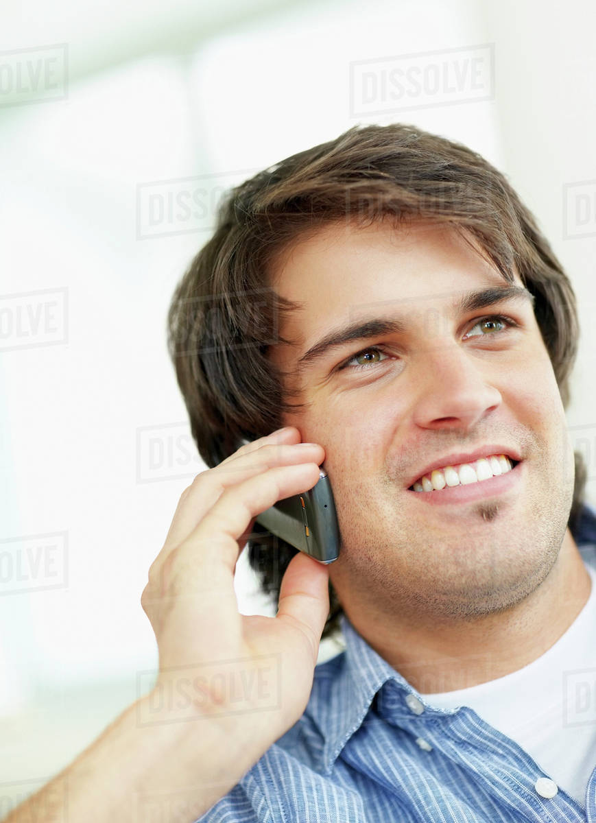 Handsome man talking on cell phone - Royalty-free Stock Photo | Dissolve