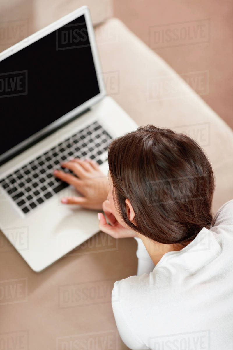 Woman browsing the internet - Royalty-free Stock Photo | Dissolve