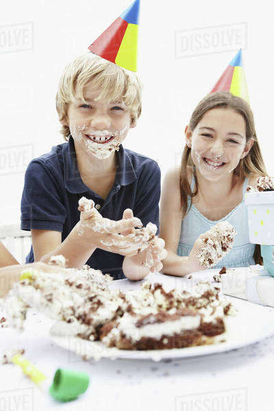 Children eating birthday cake with their hands - Royalty-free Stock ...