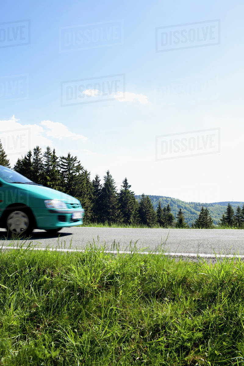 Car on country road - Royalty-free Stock Photo | Dissolve