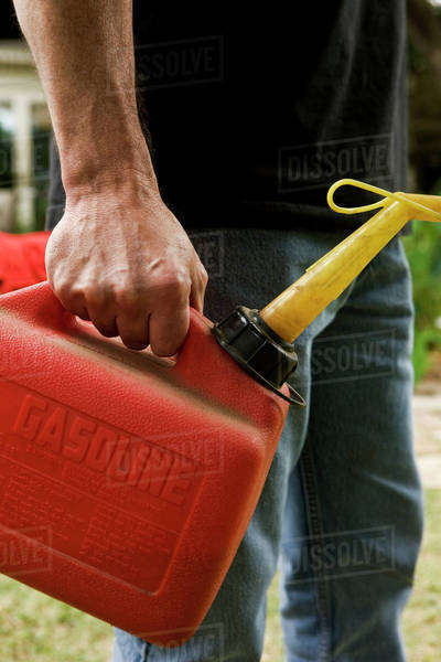 Hand holding gas can - Royalty-free Stock Photo | Dissolve
