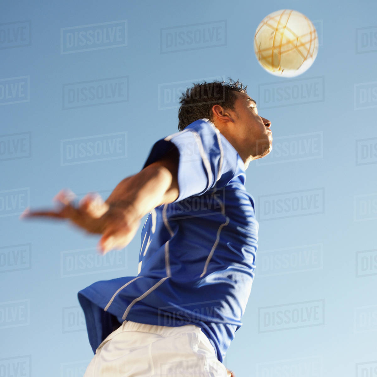 Soccer player heading the ball - Stock Photo - Dissolve