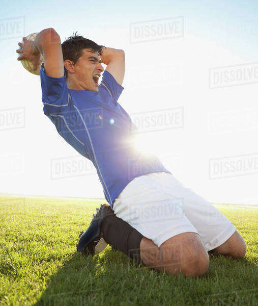 Soccer player throwing ball - Royalty-free Stock Photo | Dissolve