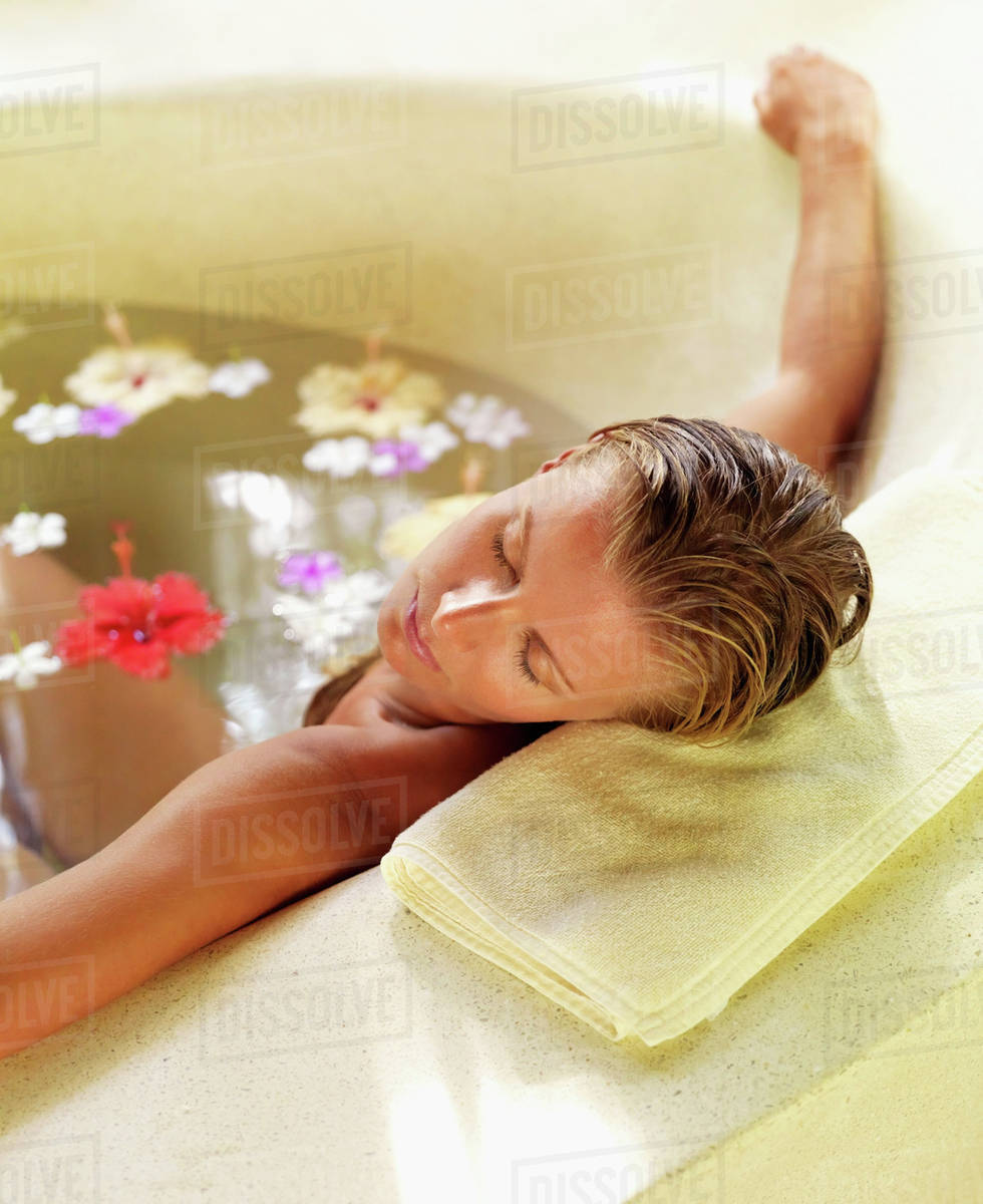 Woman relaxing in bathtub - Royalty-free Stock Photo | Dissolve