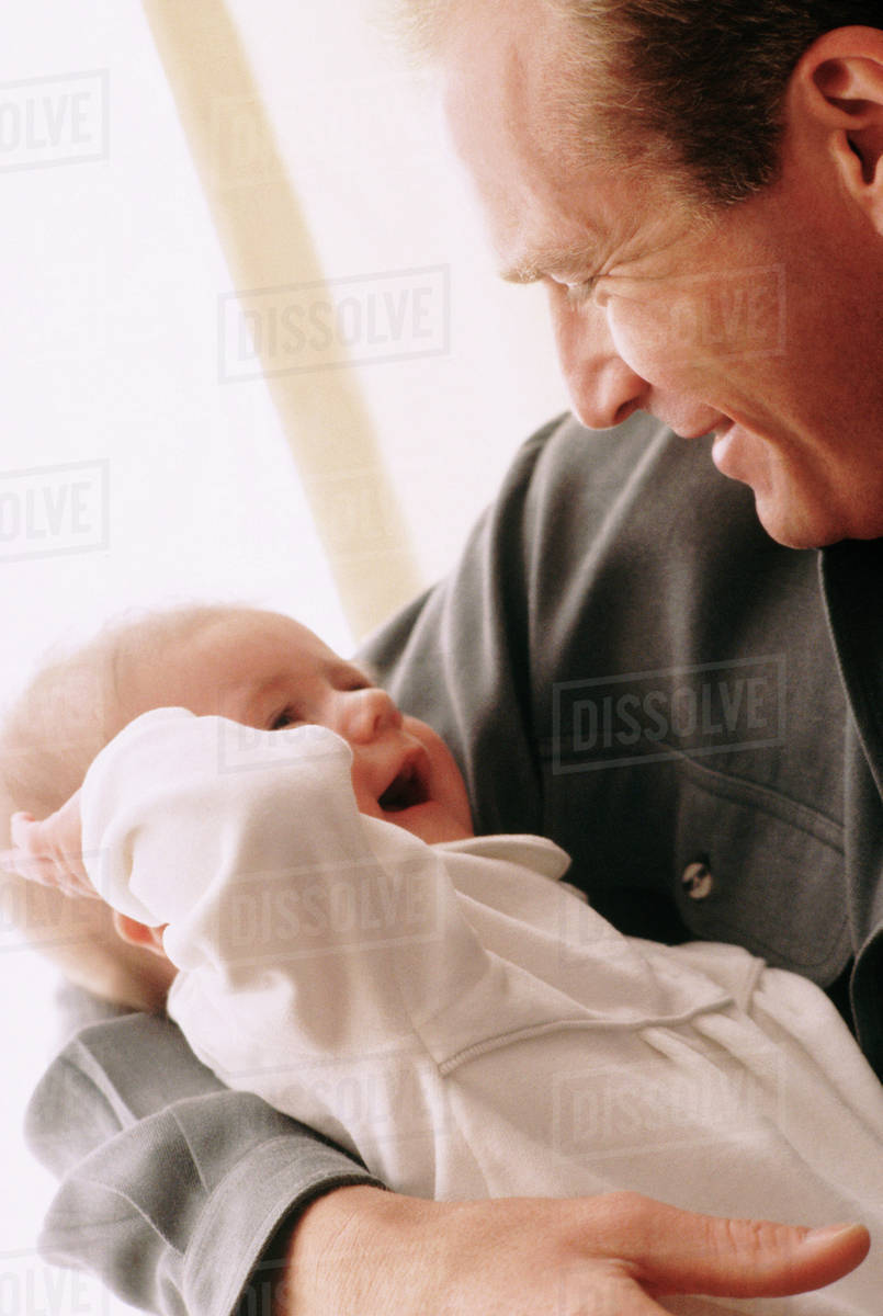 Father smiling at his baby - Royalty-free Stock Photo | Dissolve