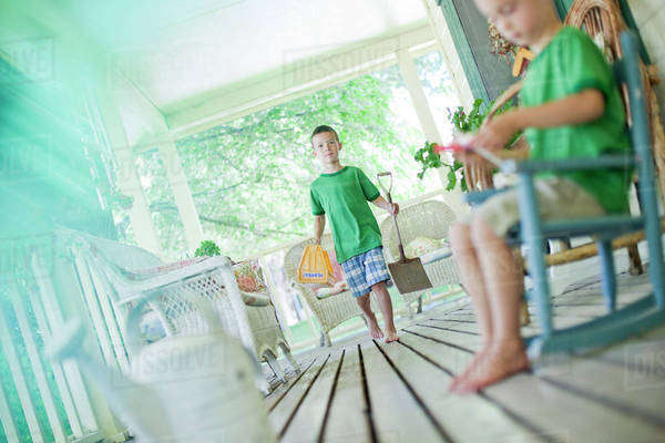 Two young boys on porch - Stock Photo - Dissolve