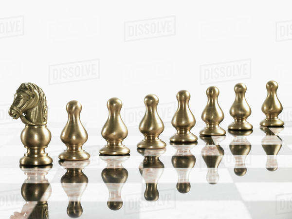 Knight with pawn chess pieces on board - Royalty-free Stock Photo ...
