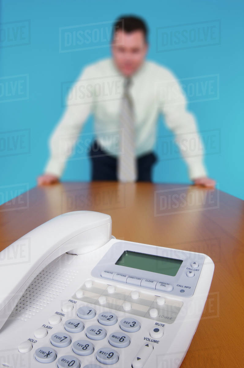 Businessman waiting by telephone - Royalty-free Stock Photo | Dissolve