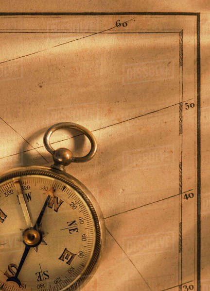 Close up of antique map and compass - Stock Photo - Dissolve