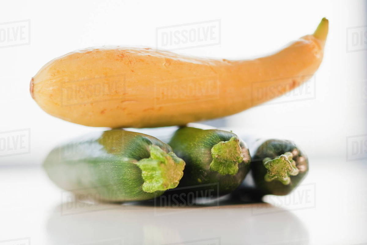Four courgettes - Royalty-free Stock Photo | Dissolve