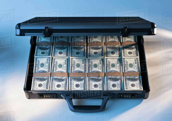 Money in a briefcase - Stock Photo - Dissolve