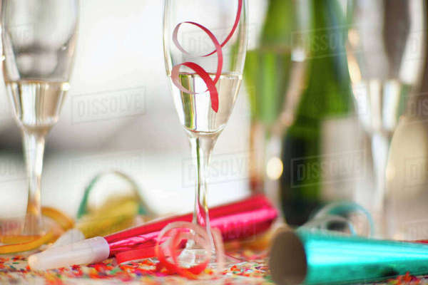 Champagne bottle and party supplies - Royalty-free Stock Photo | Dissolve