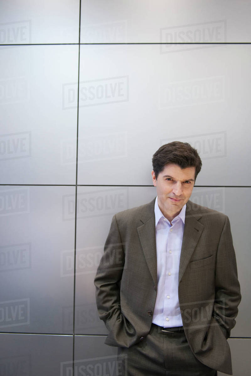 A businessman by a wall - Royalty-free Stock Photo | Dissolve