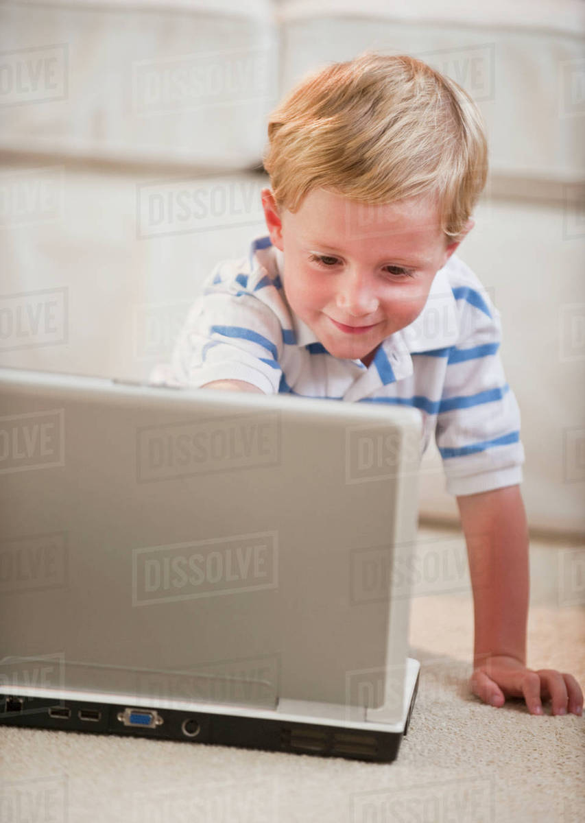 Child playing on computer - Royalty-free Stock Photo | Dissolve