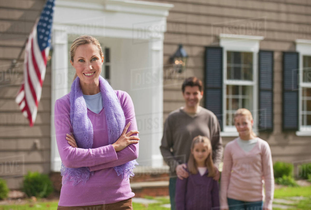 Family in front of house - Royalty-free Stock Photo | Dissolve