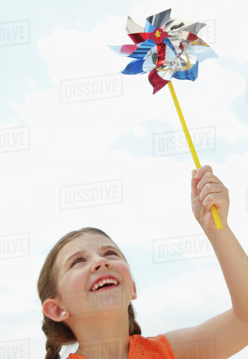 Child with pinwheel - Royalty-free Stock Photo | Dissolve