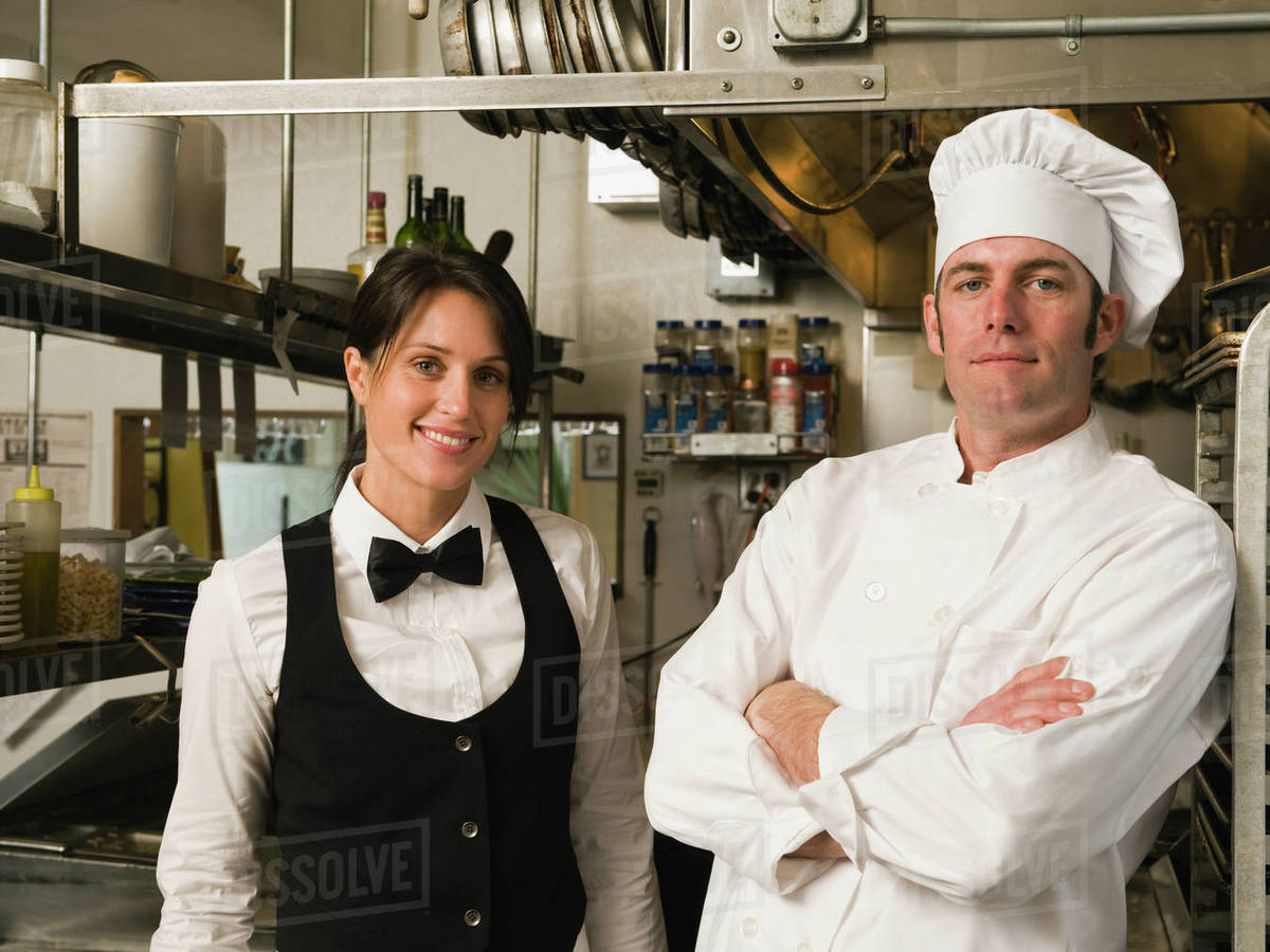Chef and waitress posing in restaurant kitchen - Royalty-free Stock ...