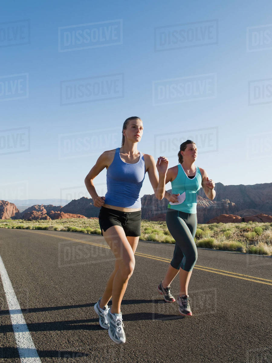 Runners on a road - Stock Photo - Dissolve