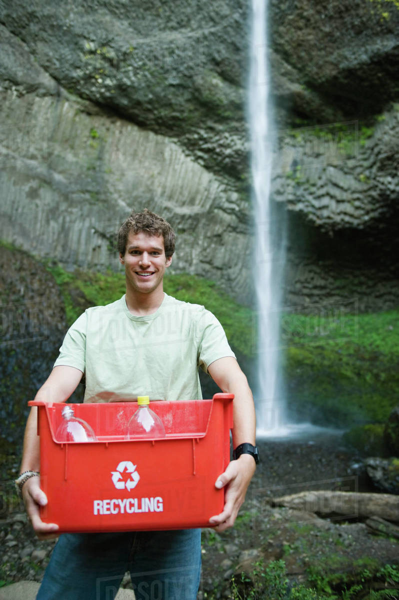 Man with recycling bin - Royalty-free Stock Photo | Dissolve