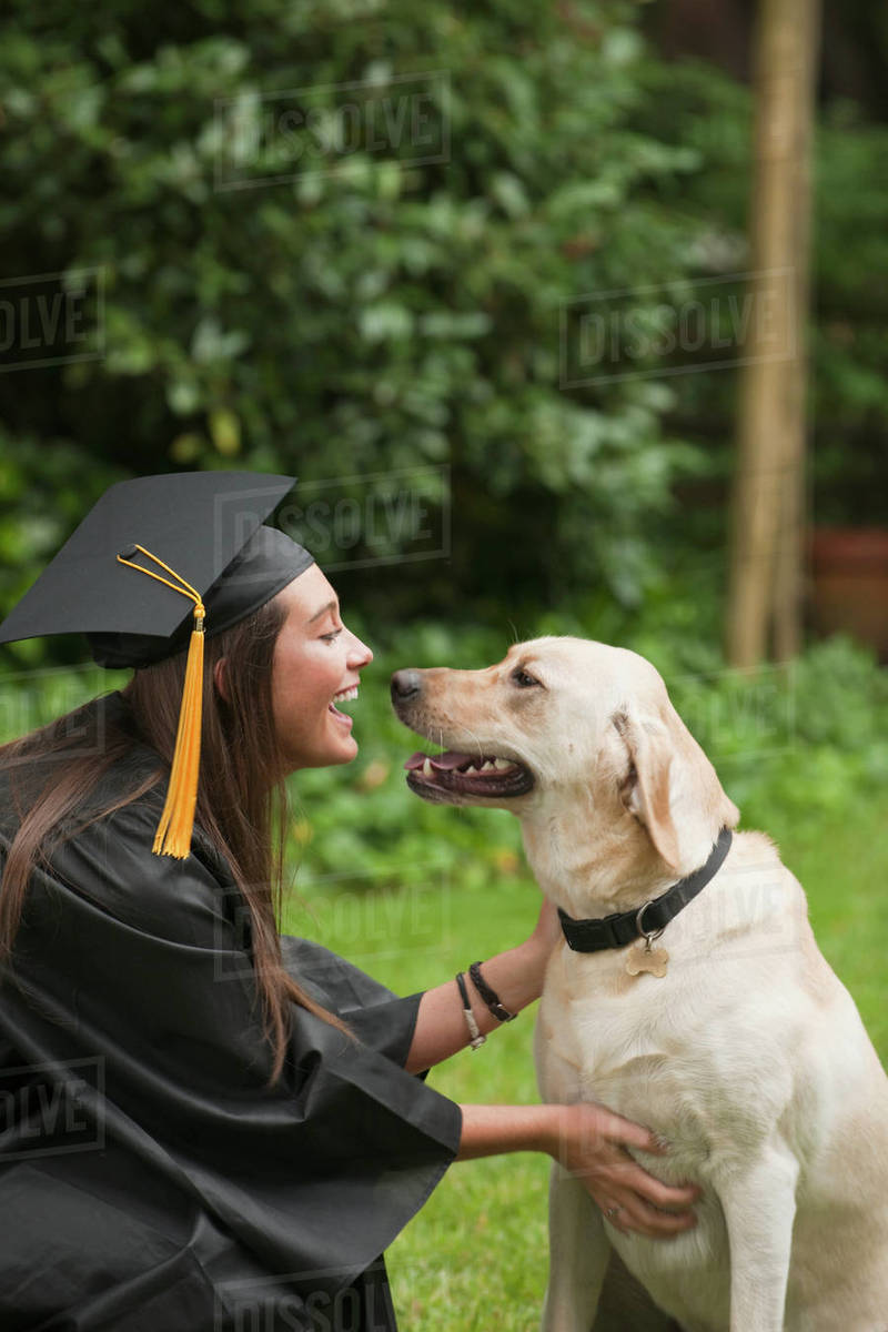 Graduate and dog - Royalty-free Stock Photo | Dissolve