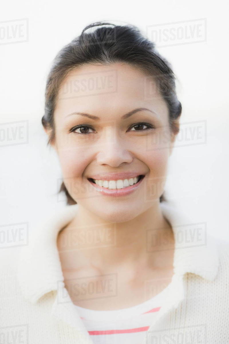 Portrait of woman smiling, outdoors - Royalty-free Stock Photo | Dissolve