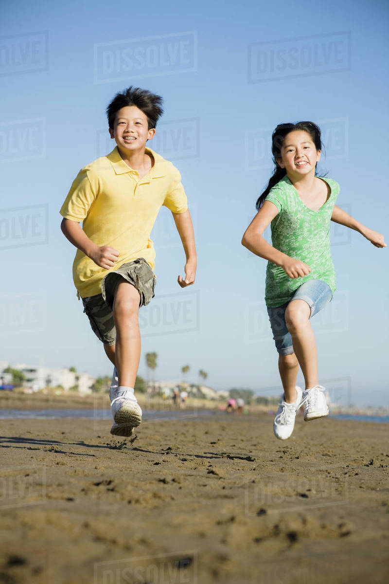 Children running on beach - Royalty-free Stock Photo | Dissolve