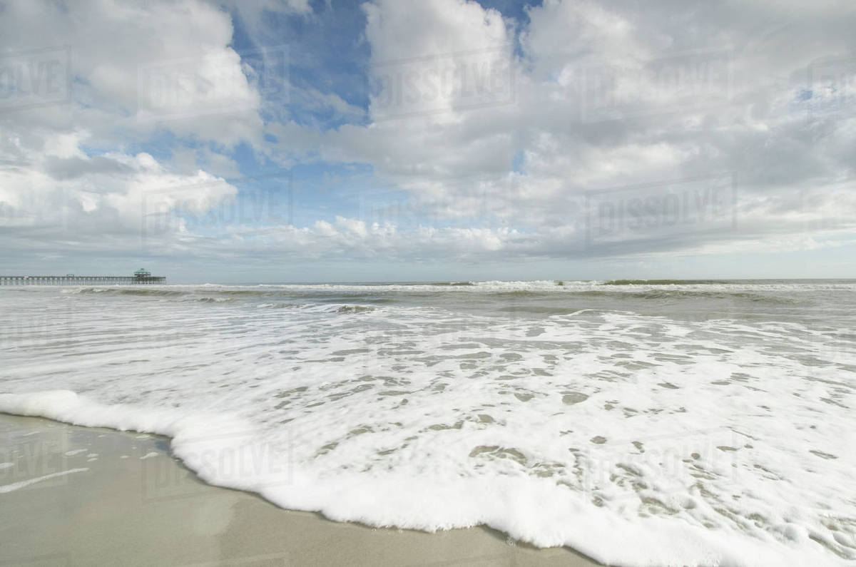 Cumulus clouds over sea - Royalty-free Stock Photo | Dissolve