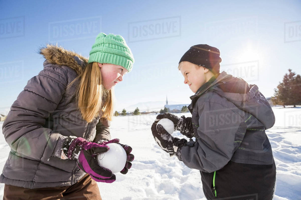 Children (8-9, 10-11) playing with snowballs - Royalty-free Stock Photo ...