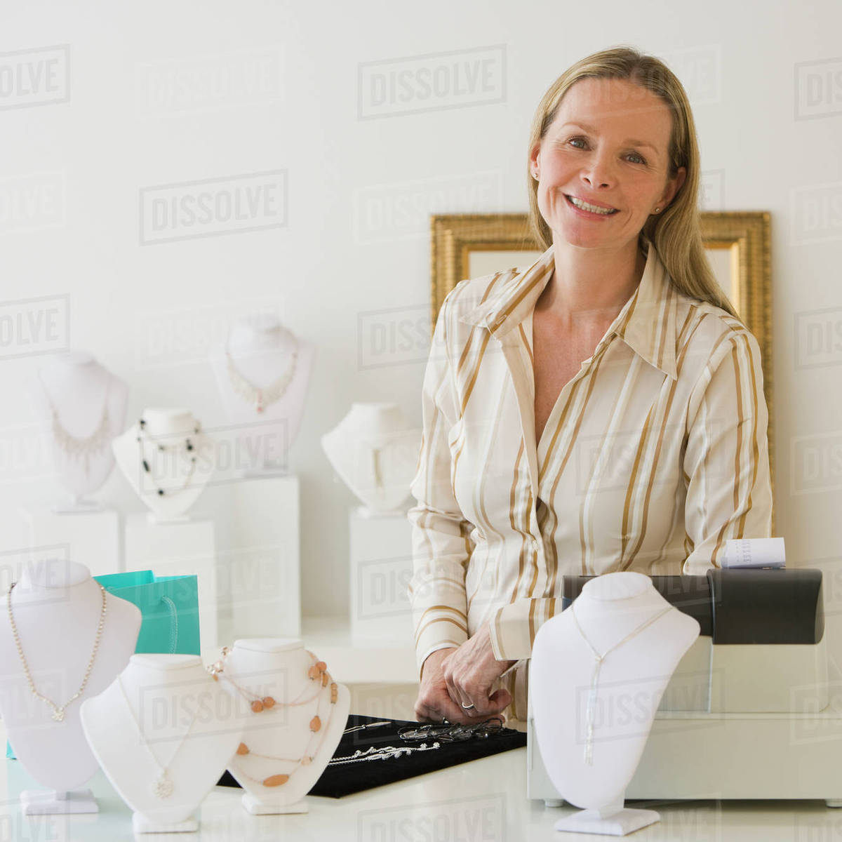 Woman behind counter at jewelry store - Royalty-free Stock Photo | Dissolve