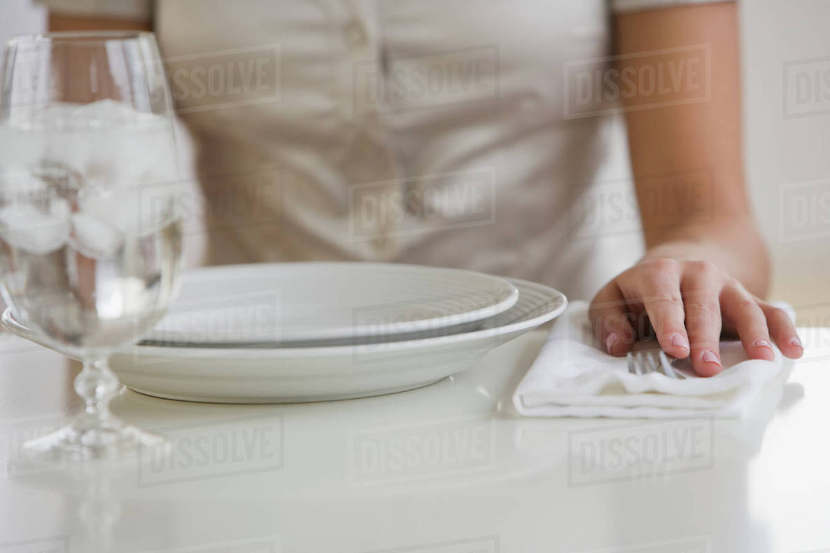 Close up of woman sitting at table - Royalty-free Stock Photo | Dissolve
