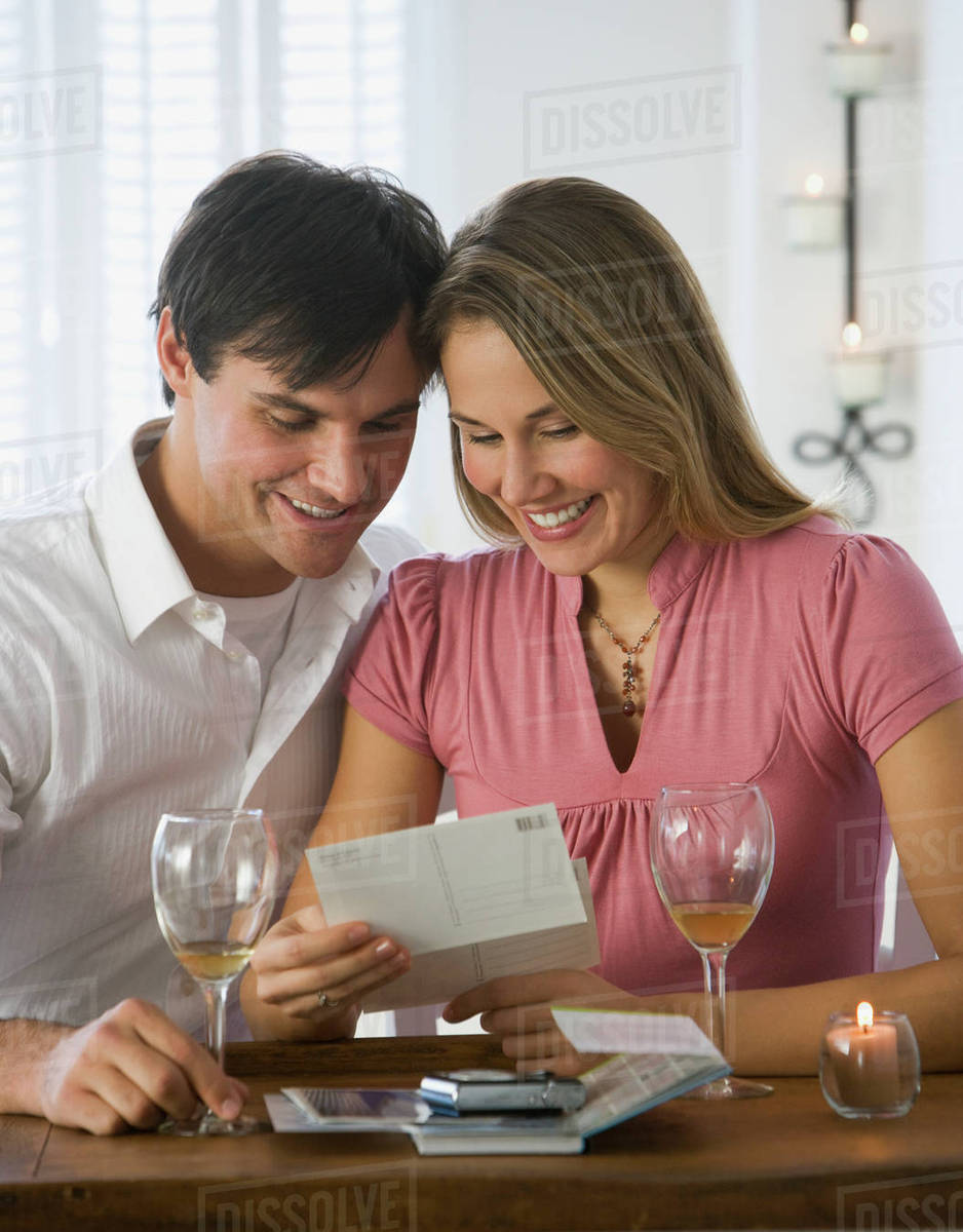 Couple reading mail - Royalty-free Stock Photo | Dissolve