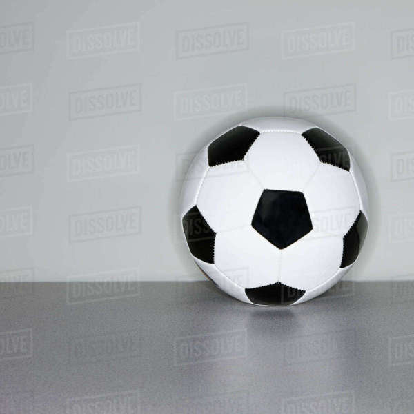Soccer ball next to wall - Royalty-free Stock Photo | Dissolve