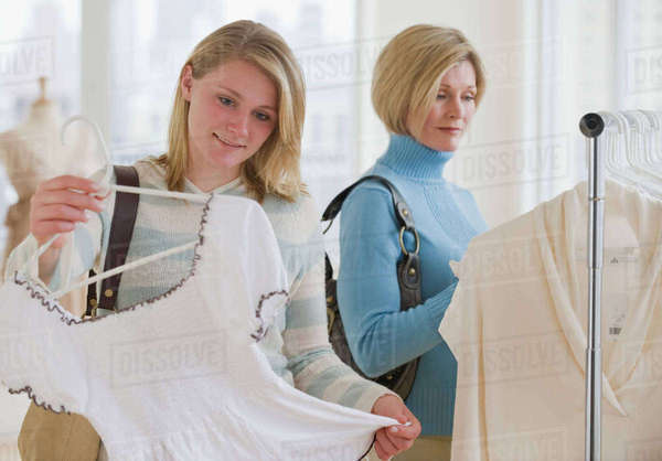 Mother and daughter clothes shopping - Royalty-free Stock Photo | Dissolve