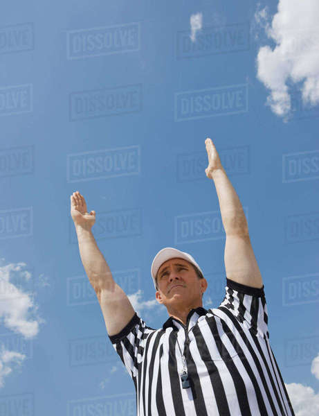 Male football referee making touchdown call - Royalty-free Stock Photo ...